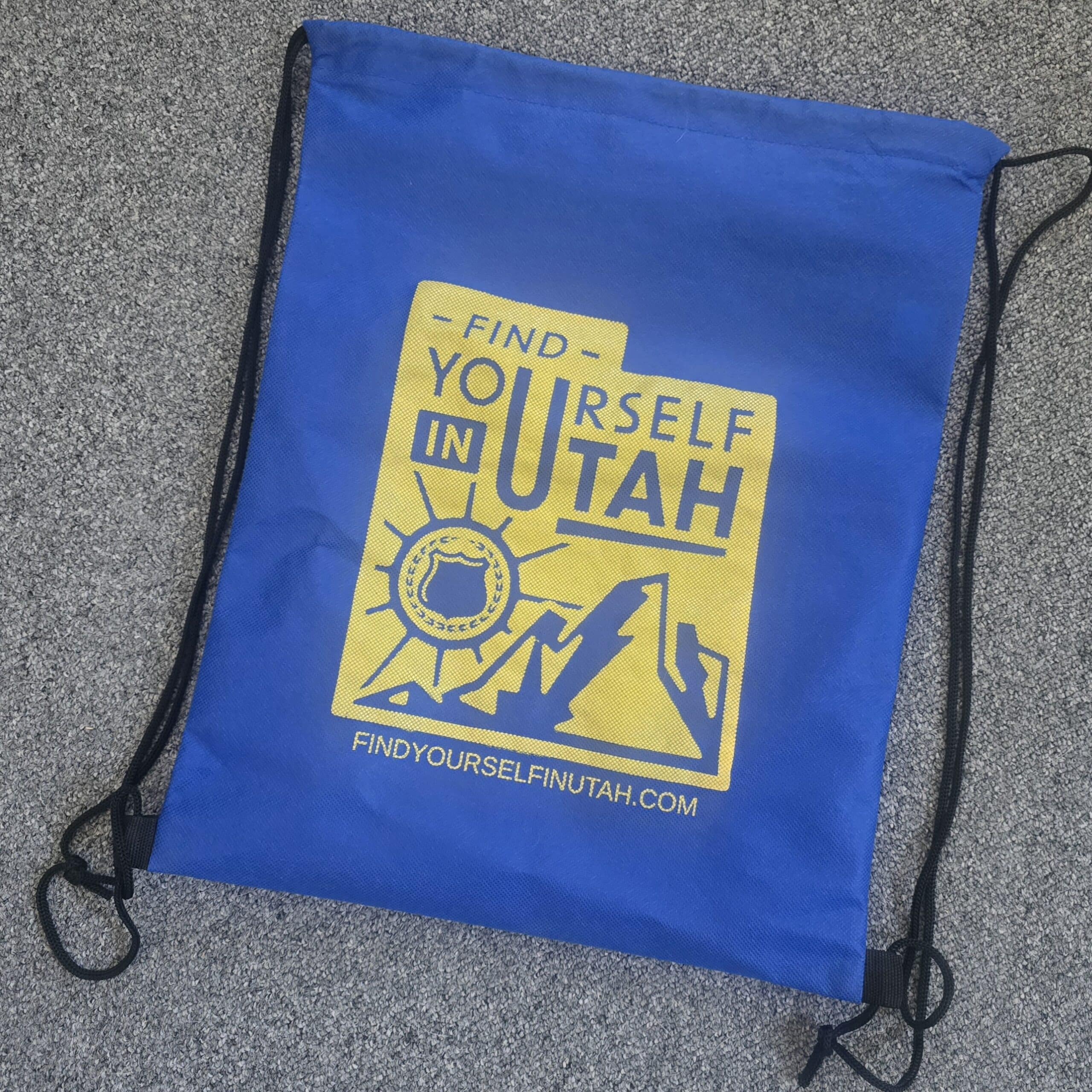 500 Customized Drawstring Backpacks | John Guilfoil Public Relations